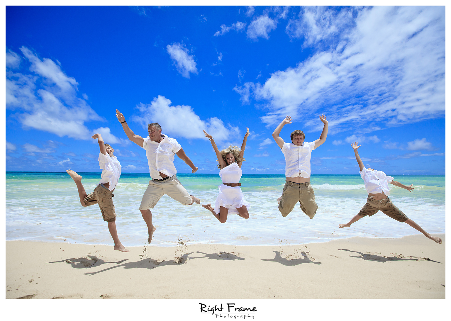 Oahu family portrait on the beach by RIGHT FRAME PHOTOGRAPHY
